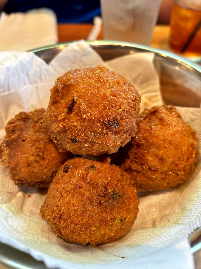 Golden-brown spheres of cornmeal perfection &ndash; these hush puppies aren't just side dishes, they're the main event that'll make you question all other fried foods.
