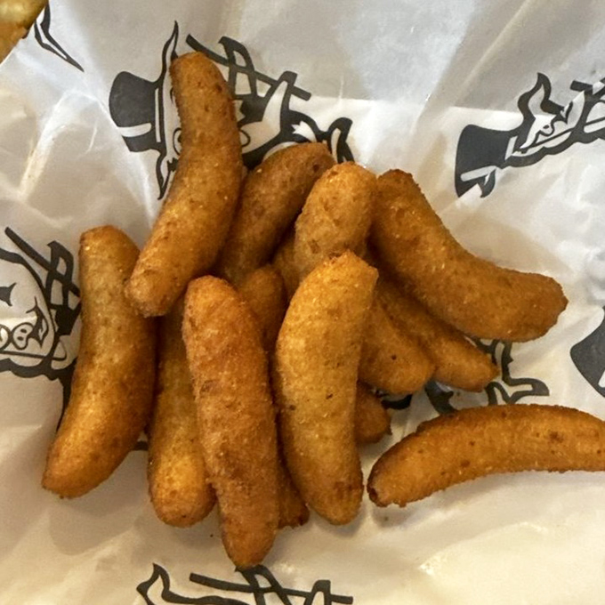 Golden-brown cornmeal torpedoes that could make a vegetarian question their life choices. These hush puppies don't just speak &ndash; they sing.
