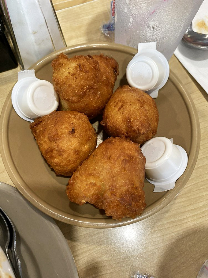 These golden-brown hush puppies aren't just side dishes&mdash;they're the main event, with a crispy exterior hiding a steamy, tender soul.