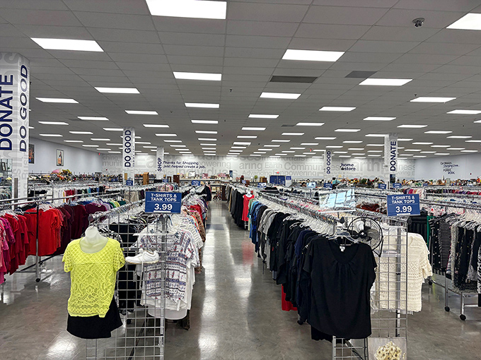 First glimpse inside reveals the organized chaos that makes thrifting so addictive—racks upon racks of possibilities stretching toward fluorescent infinity.