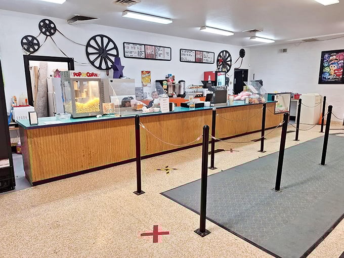 The concession stand&mdash;where movie theater popcorn meets nostalgia. Those film reels on the wall aren't just decoration; they're time machines to simpler days.