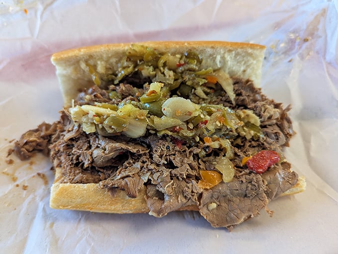 Behold the star attraction: thinly sliced beef piled high on French bread with giardiniera. This isn't just a sandwich &ndash; it's edible architecture with attitude.