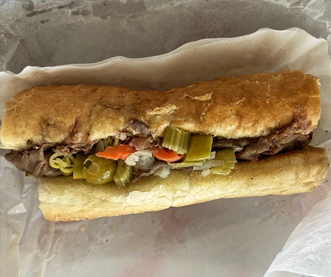 Behold the Italian beef in all its glory&mdash;thinly sliced beef, vibrant giardiniera, and a roll that's somehow managing to contain all that juicy goodness.