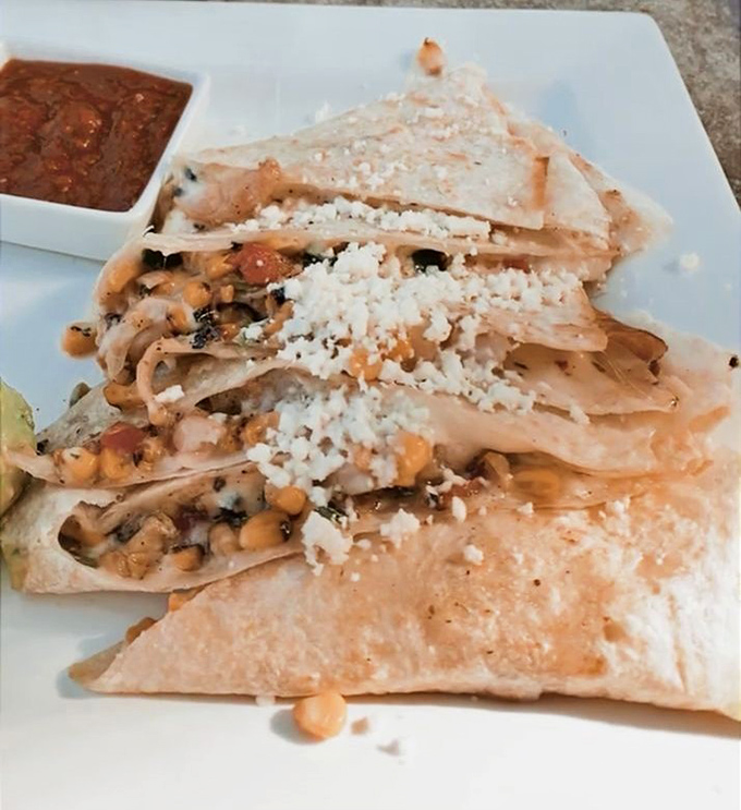 The Jalisco Shrimp Quesadilla arrives like a well-dressed celebrity&mdash;golden-crisp exterior, perfectly melted interior, and topped with a sprinkle of cotija that steals the show.