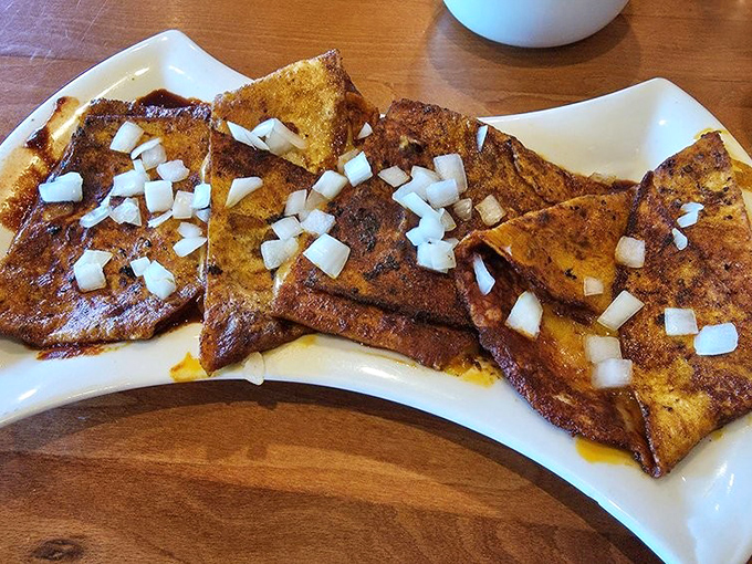 These Jemez Enchiladas aren't just food&mdash;they're edible time machines. The blue corn tortillas dipped in red chile tell stories your taste buds have been waiting to hear.