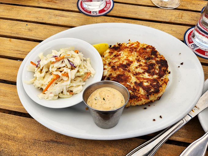 Golden-crusted perfection! This jumbo crab cake is what seafood dreams are made of &ndash; mostly crab, minimal filler, and that remoulade sauce deserves its own fan club.