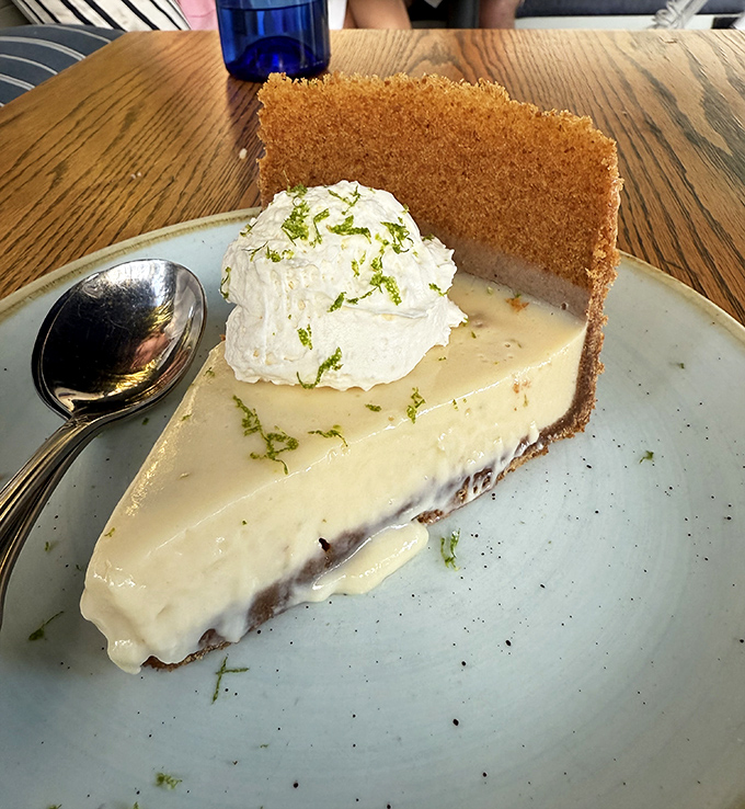 This slice of key lime perfection proves that sometimes the best things in life are yellow, tangy, and completely irresistible.
