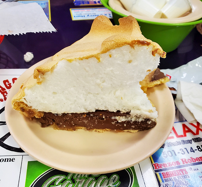 That towering meringue isn't just decoration&mdash;it's edible architecture crowning the most legendary key lime pie in the state.