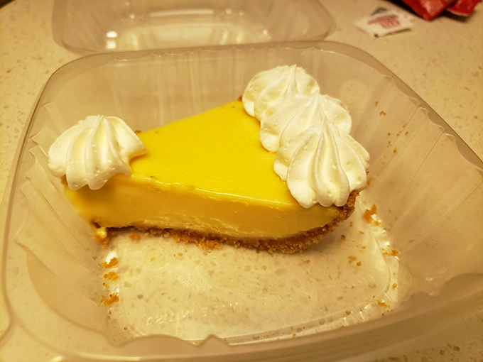 This slice of key lime pie isn't just dessert; it's Florida sunshine translated into creamy, tangy perfection on a graham cracker throne.