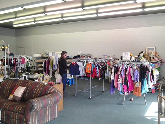 A children's section that proves kids' clothes can have multiple lifetimes. Those tiny hangers hold big possibilities for growing families.