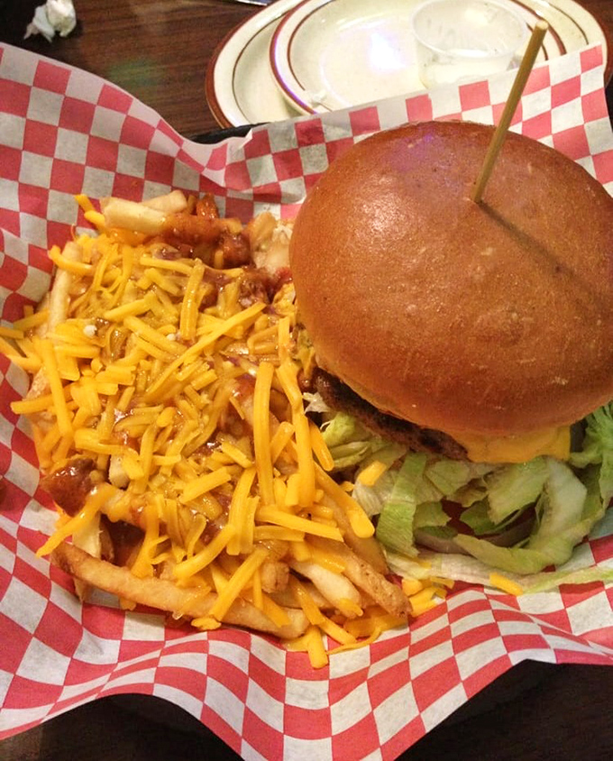 Behold the burger that launched a thousand napkins. The cheese-covered fries aren't a side dish&mdash;they're a co-star.