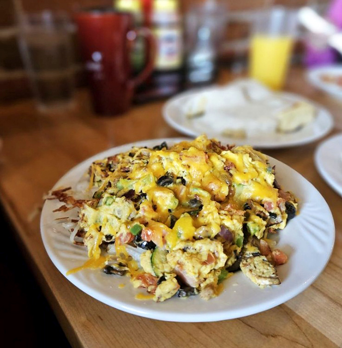 This isn't just an omelet&mdash;it's a colorful landscape of morning possibilities, where cheese cascades over a mountain of fresh ingredients.