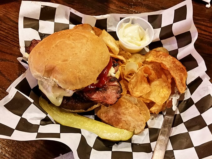 This isn't just a burger—it's a commitment. Served with house-made chips and a pickle spear, it's the kind of meal that demands a post-lunch nap.
