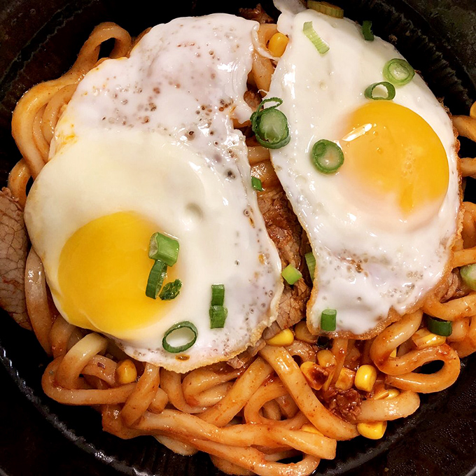 These Korean fire noodles don't just bring heat—they tell a story. Topped with perfectly fried eggs, they're what Goku would eat after saving the universe.
