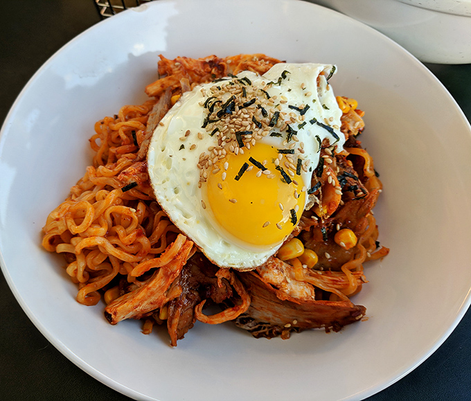 These Korean Fire Noodles don't just sit on your plate&mdash;they perform. The sunny-side-up egg crowns a mountain of spicy noodles and tender meat like a delicious halo.