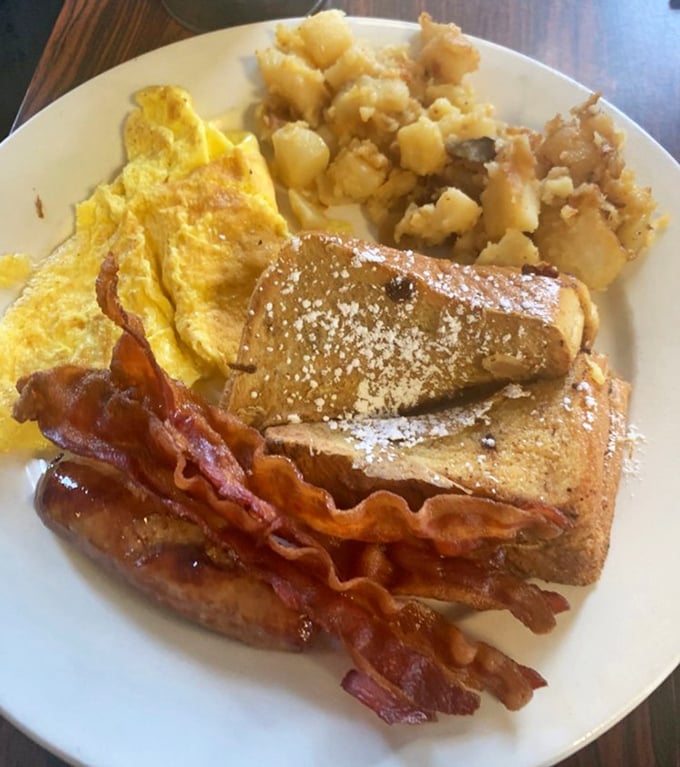 Breakfast perfection doesn't need fancy plating &ndash; golden French toast, crispy bacon, fluffy eggs, and home fries that could make a potato proud.