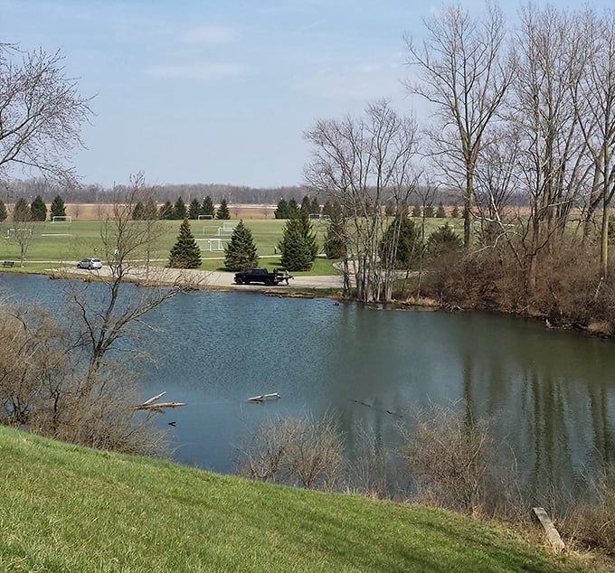 Serenity now! Kyle Park's peaceful pond reflects the surrounding landscape, offering a perfect spot for contemplation or catching the one that got away.