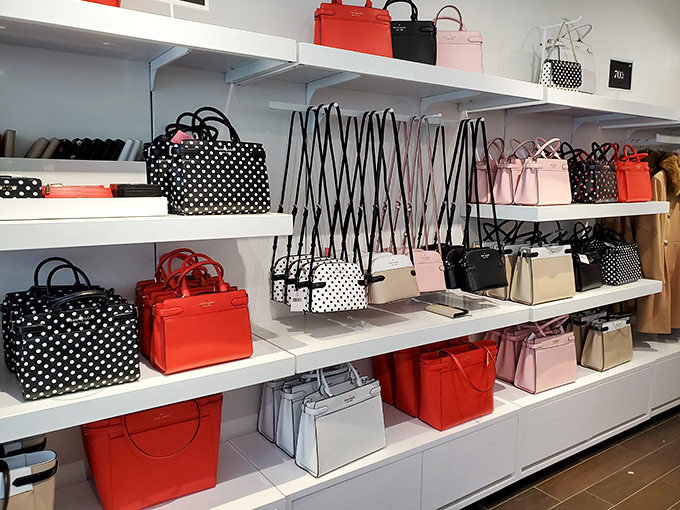 Kate Spade's handbag display&mdash;where colorful leather treasures wait patiently to become the most expensive item you'll justify as "an investment piece."