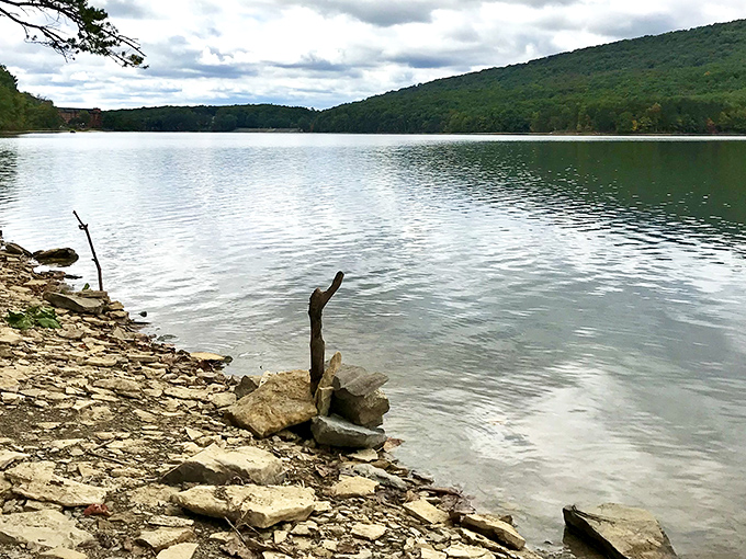 Lake Habeeb's tranquil waters reflect the surrounding mountains, offering a meditation session that doesn't require an app subscription.