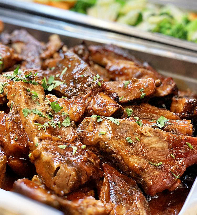 These glistening, herb-flecked ribs aren't just meat&mdash;they're edible poetry. Each bite tells a story of slow-cooking mastery that would make any Brazilian grandmother proud.