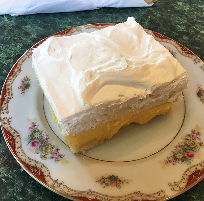 Behold the legendary lemon cheesecake bar in all its glory&mdash;three perfect layers of buttery crust, creamy cheesecake, and bright lemon topped with cloud-like whipped cream.