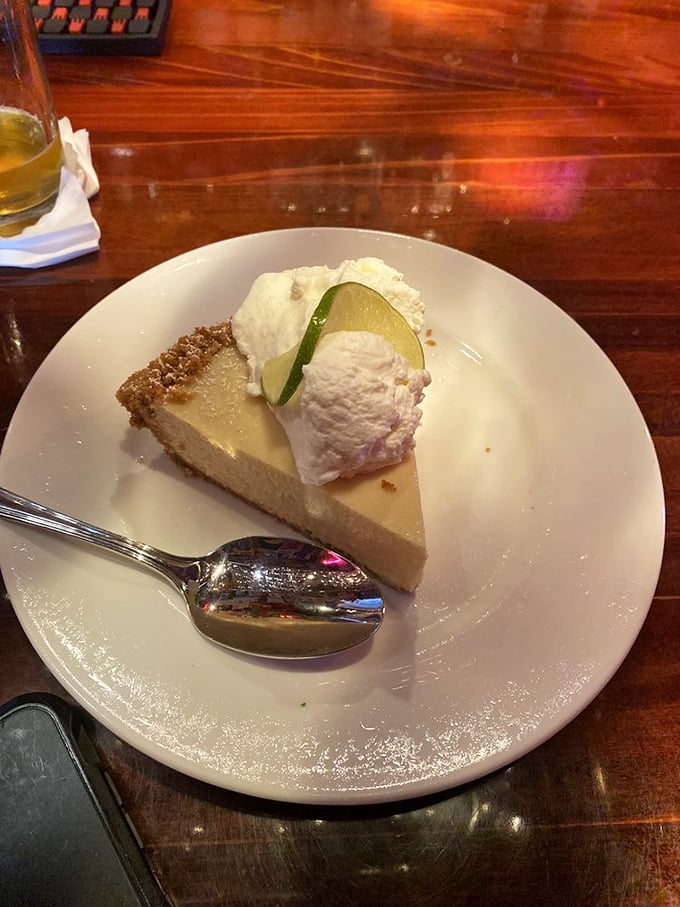 The star of the show: key lime pie that strikes the perfect balance between tart and sweet, topped with a dollop of whipped cream and a lime slice smile.