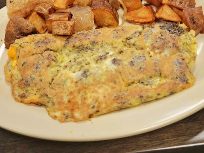 The legendary livermush omelet arrives like a humble hero, its golden exterior hiding treasures of regional flavor that no fancy brunch spot could ever replicate.
