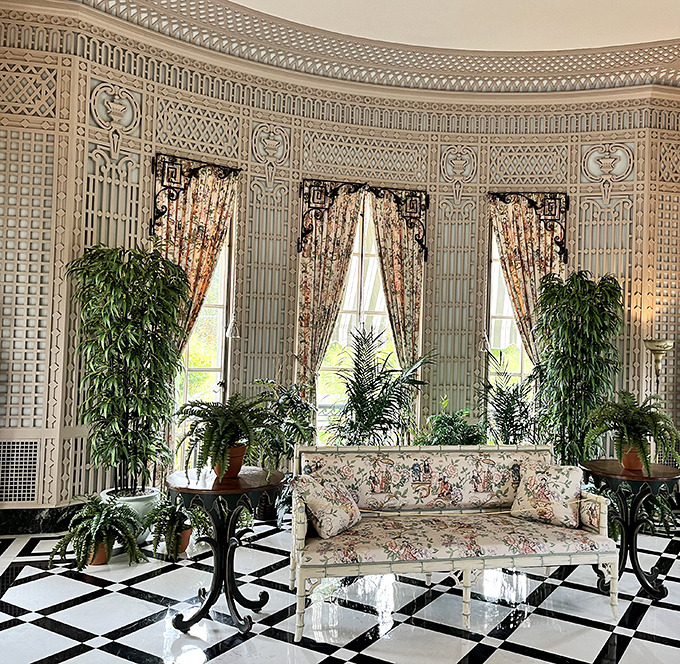 The conservatory where plants live better than most humans. Those lattice walls aren't just decorative&mdash;they're reminding your houseplants how inadequate they are.