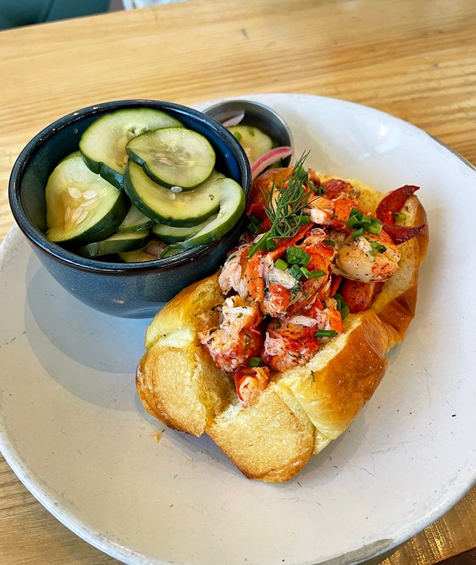 This lobster roll isn't just a sandwich; it's a masterpiece of sweet meat and buttery goodness that would make a New Englander weep with joy.