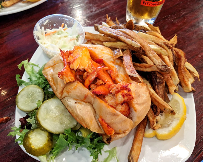 Behold the star attraction: chunks of lobster bathed in butter, nestled in a toasted roll, with fries standing by for the inevitable encore.