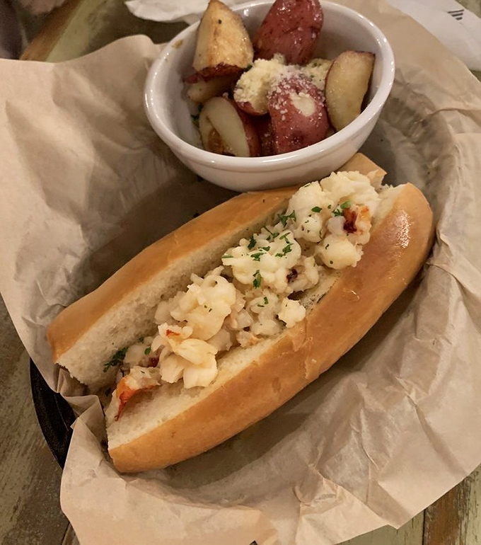 The star of the show: chunks of sweet lobster meat nestled in a perfectly toasted roll. Maine meets North Carolina in this handheld masterpiece.