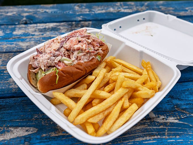 The star of the show: Kay's legendary lobster roll, bursting with sweet meat and nestled beside golden fries. This isn't just lunch &ndash; it's a Massachusetts maritime celebration.