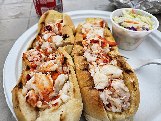 Behold the heavyweight champion of lobster rolls, dressed in butter and ready to rumble.