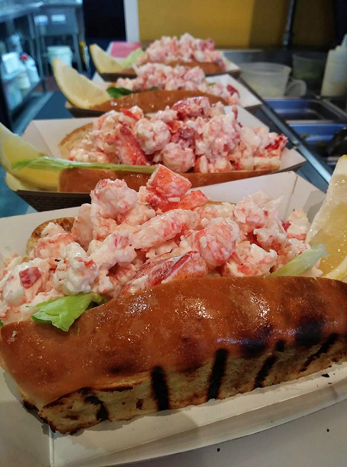 Lobster roll nirvana! These beauties are packed with chunky Maine lobster meat on perfectly toasted split-top rolls. The lemon wedge isn't just garnish&mdash;it's essential punctuation.