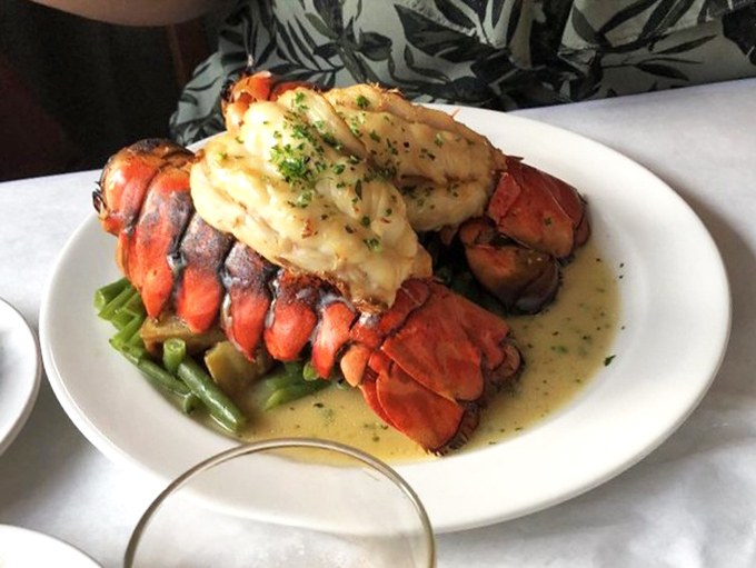 This lobster tail isn't just dinner; it's a maritime celebration on a plate, complete with clarified butter that's practically liquid gold.