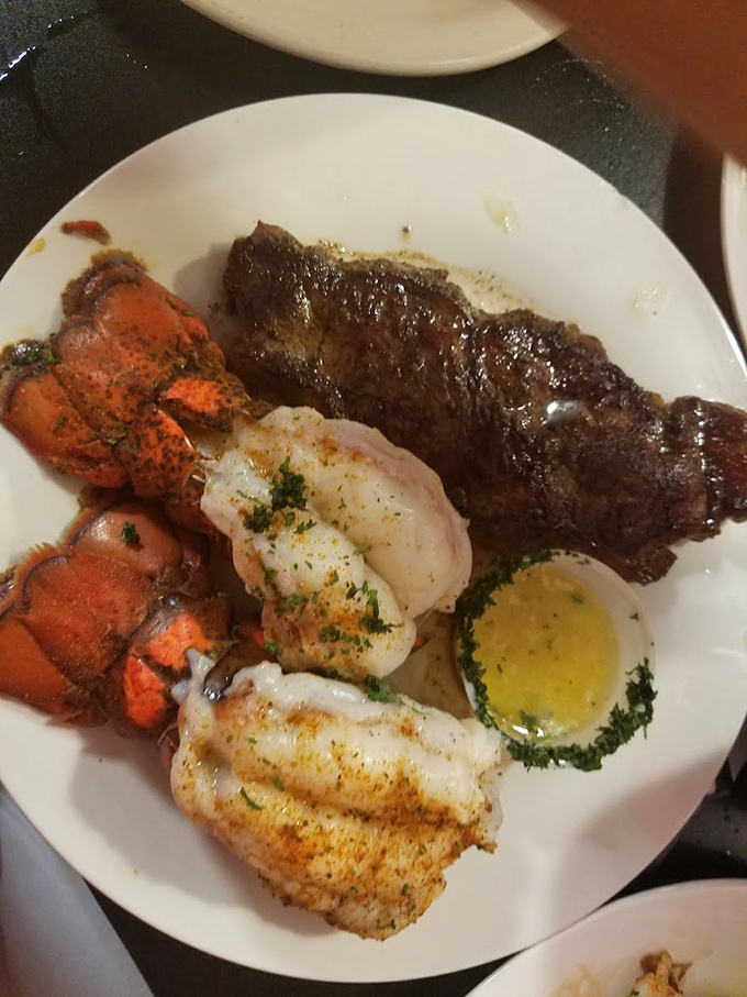 Surf and turf nirvana! That butter-drenched lobster tail isn't just dinner&mdash;it's the reason elastic-waist pants were invented.