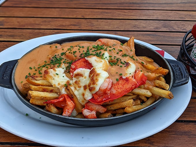 Lobster poutine that makes Canadians jealous&mdash;tender chunks of lobster meat lounging atop crispy fries under a blanket of melted cheese and savory sauce.