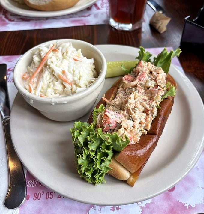 The star of the show: chunks of sweet lobster meat nestled in a perfectly toasted roll with creamy coleslaw. Maine, who?