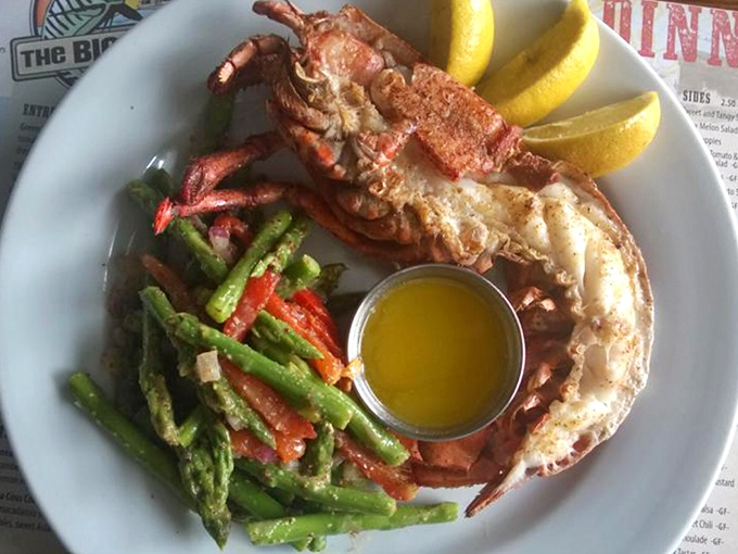 Split lobster perfection with vibrant veggies on the side. This isn't just dinner&mdash;it's a crustacean celebration worthy of a bib and a happy dance.