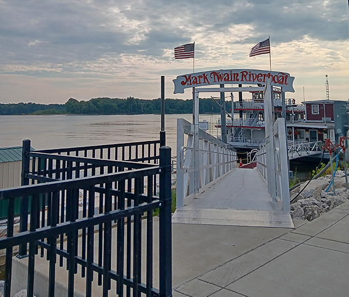 The Mark Twain Riverboat waits patiently for passengers, a white wedding cake of a vessel ready to deliver Mississippi memories.