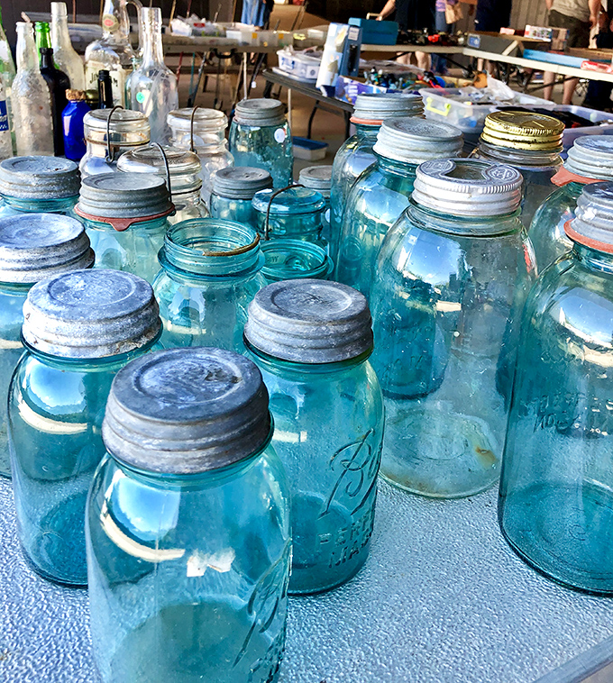 These vintage blue Ball mason jars aren't just glassware—they're time capsules from Appalachian kitchens that have witnessed generations of family recipes.