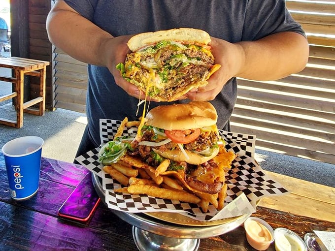 This isn't just a burger &ndash; it's an engineering marvel requiring two hands, strategic planning, and absolutely zero first-date situations.