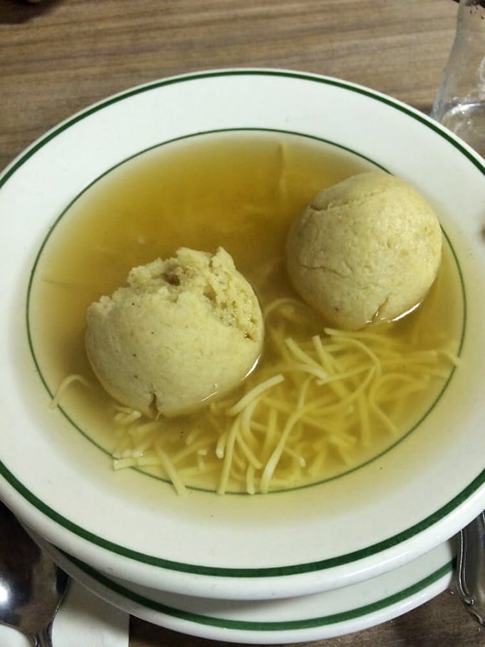 Floating like golden orbs in a sea of clear broth, these matzo balls aren't just soup—they're edible comfort, grandmother-approved and scientifically proven to cure what ails you.