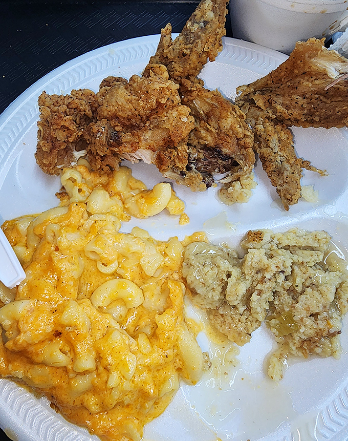 Crispy fried chicken alongside mac and cheese that's actually yellow from real cheese – a plate that whispers "diet tomorrow" in the most convincing way.