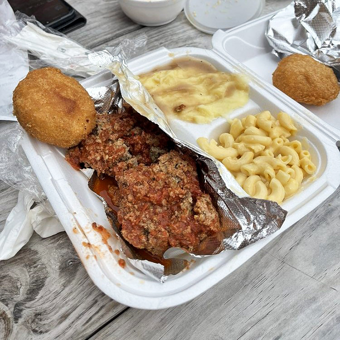 The star of the show: meatloaf that doesn't so much sit on the plate as command it, flanked by mac and cheese that's practically doing a victory lap.