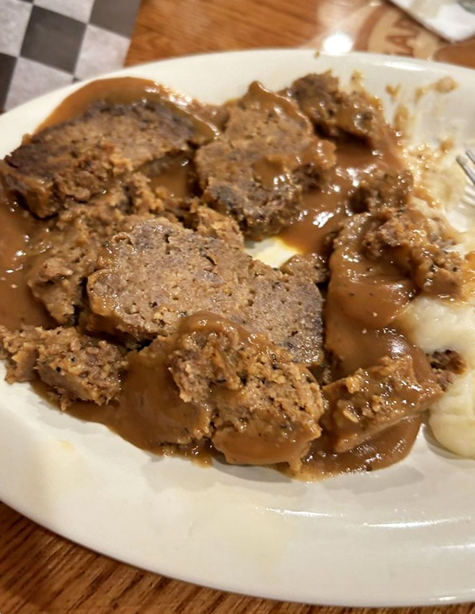 Behold the star attraction: meatloaf swimming in rich gravy alongside cloud-like mashed potatoes. Grandma would approve &ndash; and be slightly jealous.