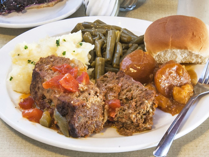 Meatloaf that doesn't apologize for being meatloaf—hearty, homestyle, and surrounded by sides that know their supporting role in this comfort food symphony.