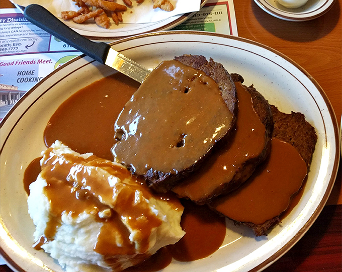 Behold the star attraction: meatloaf swimming in gravy alongside cloud-like mashed potatoes. Proust had his madeleine; Pennsylvania has this.