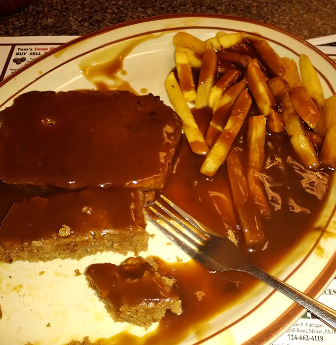 The star of the show: meatloaf swimming in rich gravy alongside golden fries. This isn't your diet plan's best friend, but it might be your taste buds' soulmate.