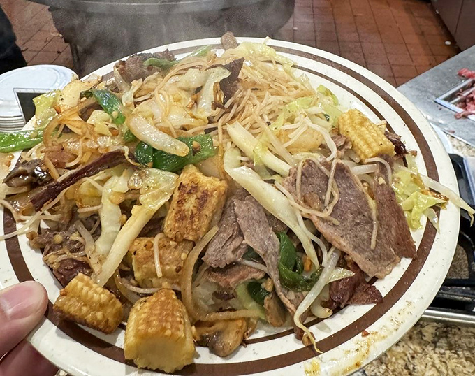 The holy grail of DIY dining: a perfectly customized Mongolian BBQ plate where every ingredient was your brilliant idea. Noodle nirvana achieved!